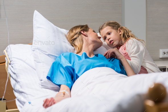 daughter spending time with sick mother at hospital Stock Photo by ...