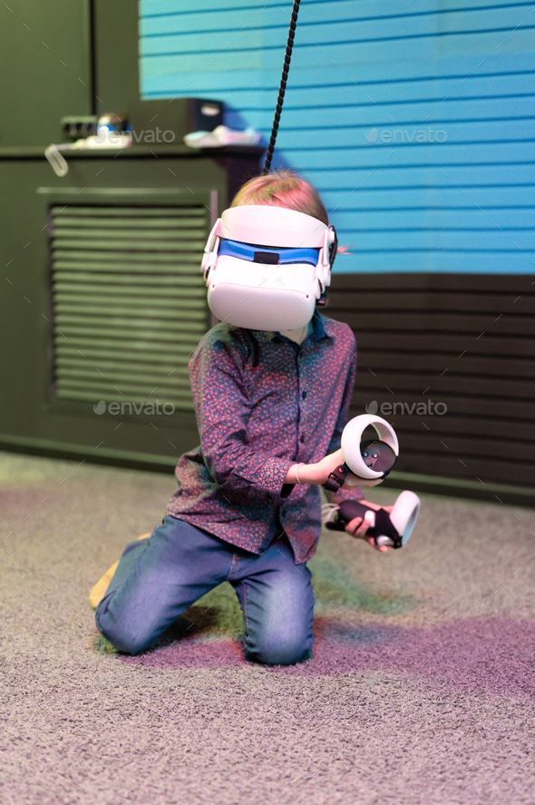 vr game and virtual reality. kid boy gamer six years old fun playing on ...