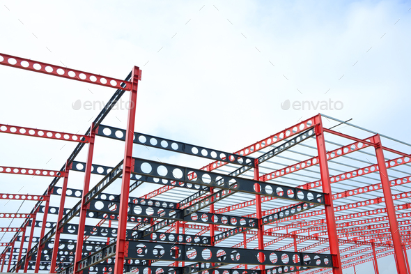 Red and black castellated beam metal structure of large industrial ...