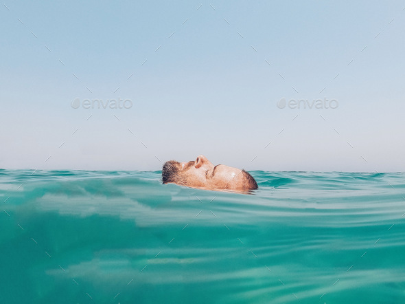 Man’s face floating on the water Stock Photo by phoenixproduction ...