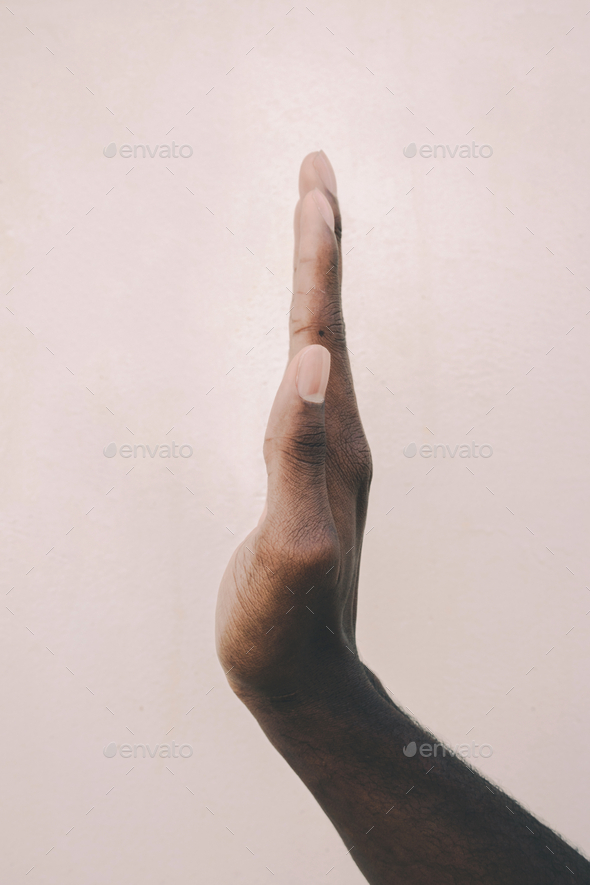 Dark skin hand held vertically Stock Photo by phoenixproduction | PhotoDune