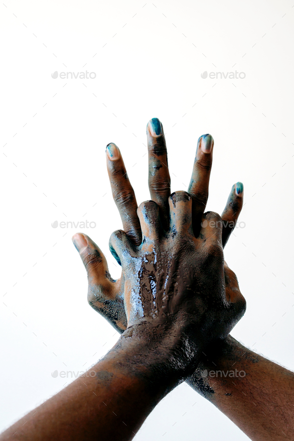 Dark skin Hands covered in blue paint Stock Photo by phoenixproduction