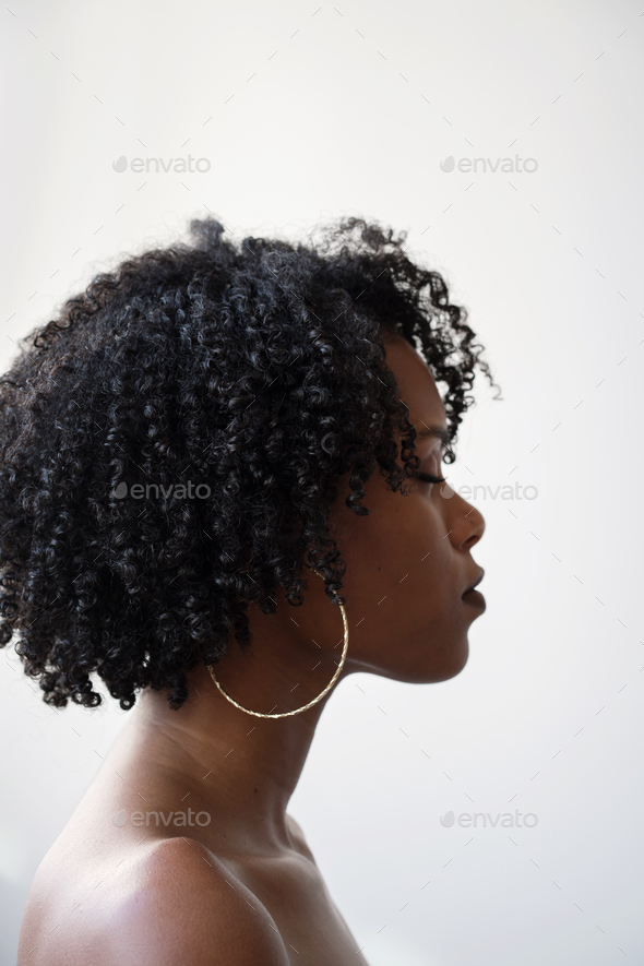 Side view Portrait of a beautiful black woman with curly hair Stock ...