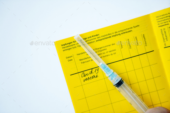 Covid 19 vaccine writing in the vaccination booklet Stock Photo by ...