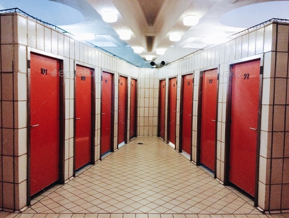 Red changing rooms in the corridor Stock Photo by phoenixproduction