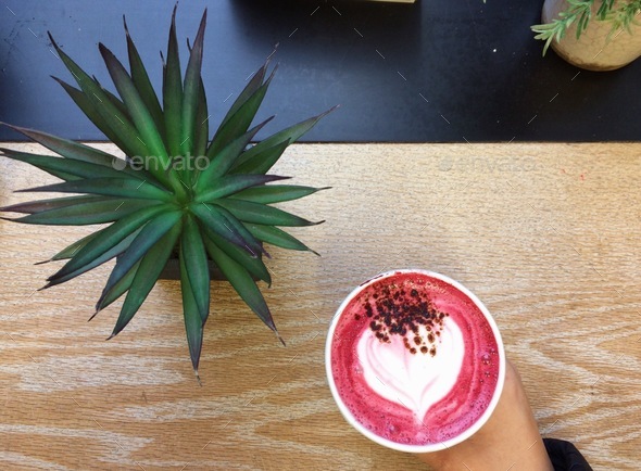 Beetroot latte at the cafe view from above Stock Photo by phoenixproduction