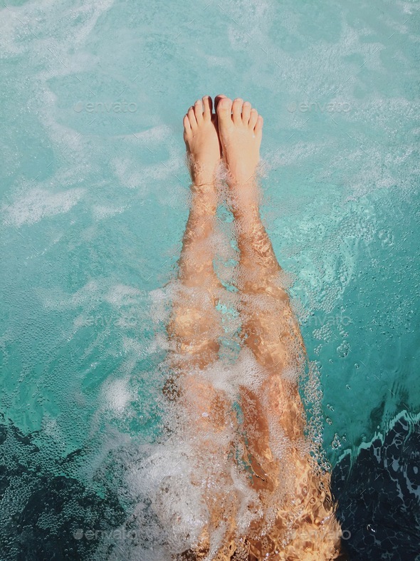Female Legs relaxing in the jacuzzi high angle view Stock Photo by ...