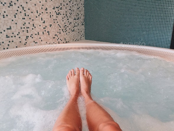 Personal perspective woman legs Relaxing in the Jacuzzi Stock Photo by ...