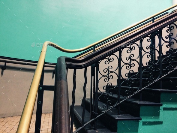 Historical stairs with a golden rail Stock Photo by phoenixproduction