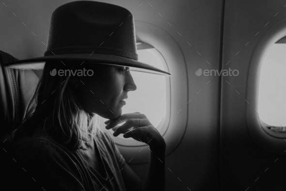 Black and white side profile portrait of woman traveling in the ...