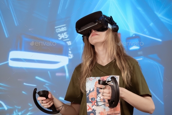 Young girl in 3D virtual reality glasses. VR glasses and helmet ...