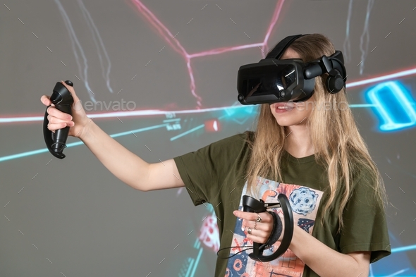 Young girl in 3D virtual reality glasses. VR glasses and helmet ...