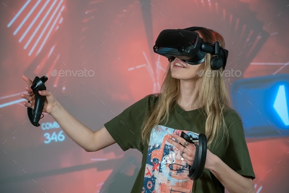 Young girl in 3D virtual reality glasses. VR glasses and helmet ...