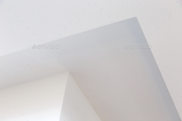 Bottom view of a wall corner and white plasterboard ceiling. Stock ...