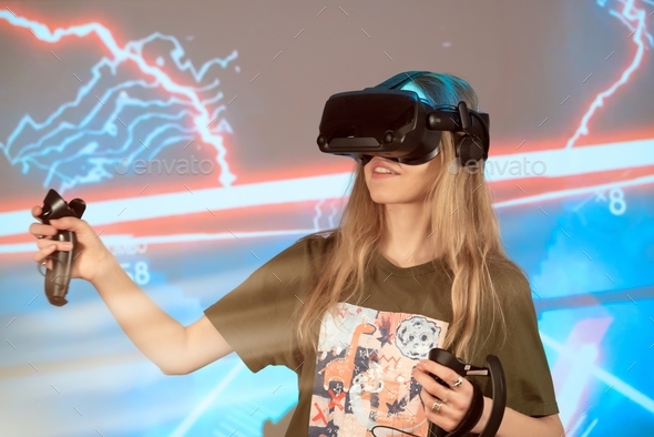 Young girl in 3D virtual reality glasses Valve Index. Stock Photo by ...