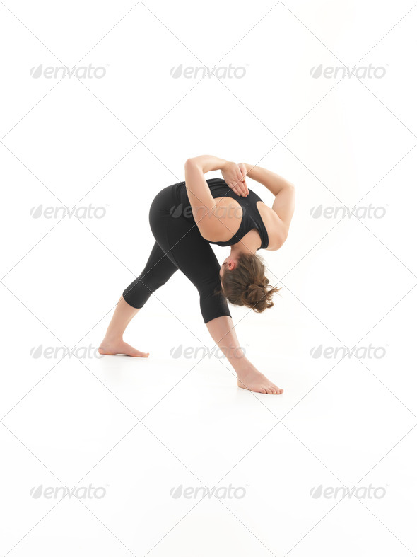 demonstration of contorting yoga posture Stock Photo by shotsstudio
