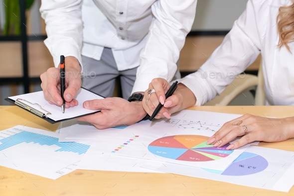 A team of young people are working on a business project in a modern ...