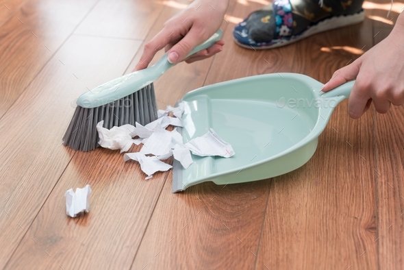 Girl brushes paper trash into a dustpan close-up Stock Photo by Tatiana ...