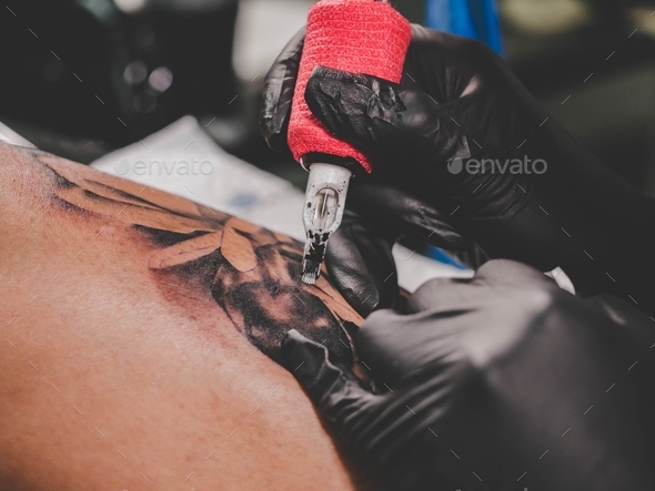 tattoo artist at work Stock Photo by Kohanova | PhotoDune