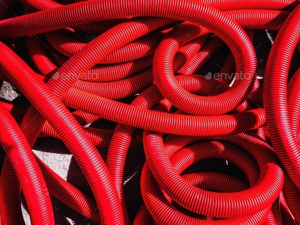 red tubes. Corrugated pipe, drainage. In the roll, close-up. Stock ...