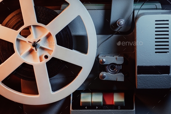 Coils with tape film turning. Analog player. Retro old-fashioned 8mm ...