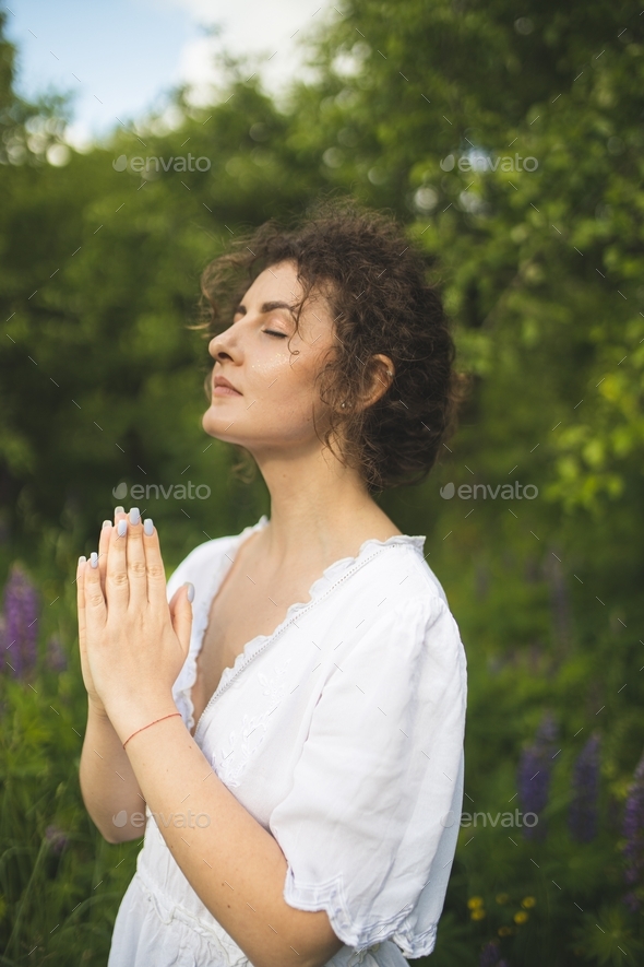 The girl is praying. Prayer to God. Believer. Hope and Prayer. Faith ...