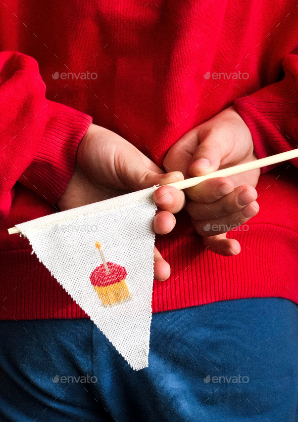 Child in red sweater holding handmade checkbox with a picture of ...