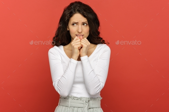 Upset worried young woman with scared nervous face expression think ...