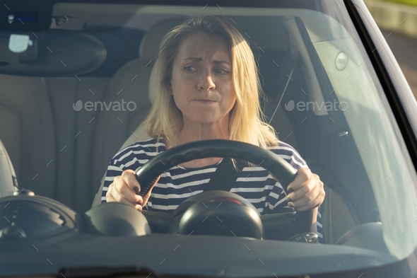 Stressed girl drives her car for the first time, tries to avoid car ...
