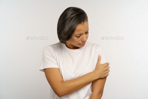 Pain in arm: sick woman pressing injured shoulder to body scared of ...