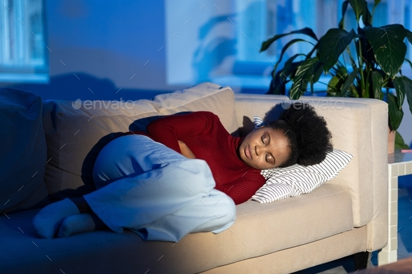 Exhausted african woman resting on sofa at home, anxious black female ...