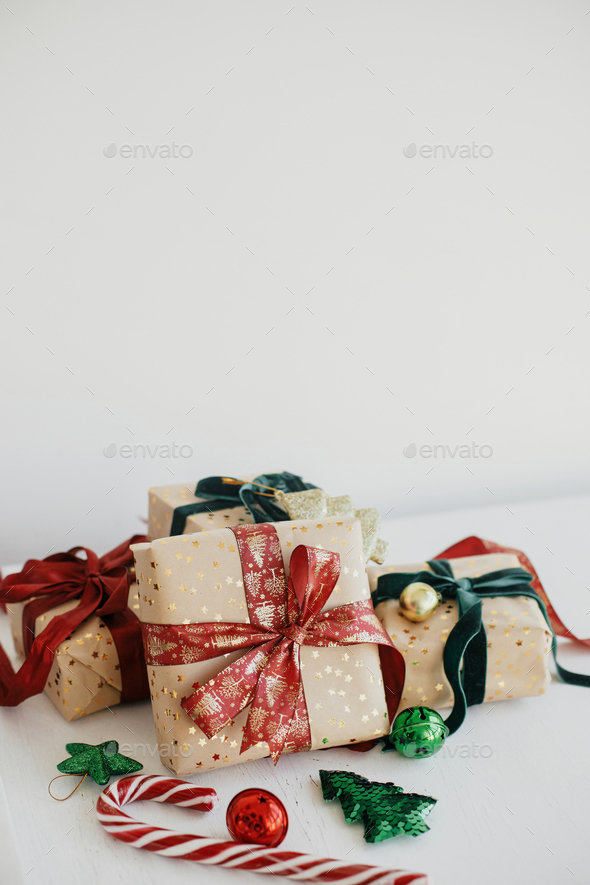 Modern wrapped christmas gift boxes and ornaments on white wood. Merry ...
