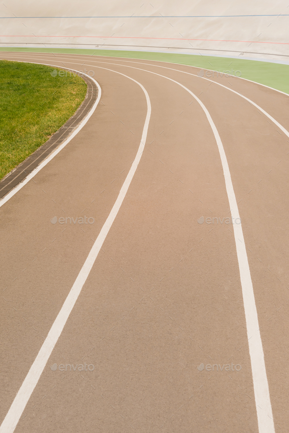 close up view of empty cycle race track Stock Photo by LightFieldStudios