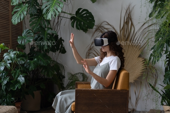 Happy girl in vr glasses touch interactive screen virtual reality for ...