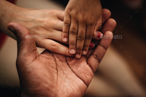 Diversity and togetherness concept, various skin tones holding hands ...