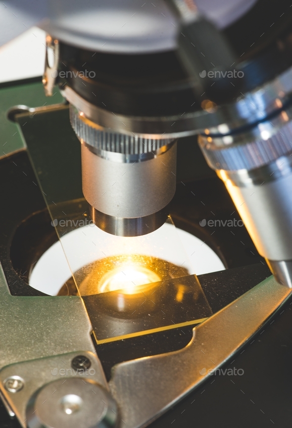 Close up of compound light microscope viewing a slide Stock Photo by ...