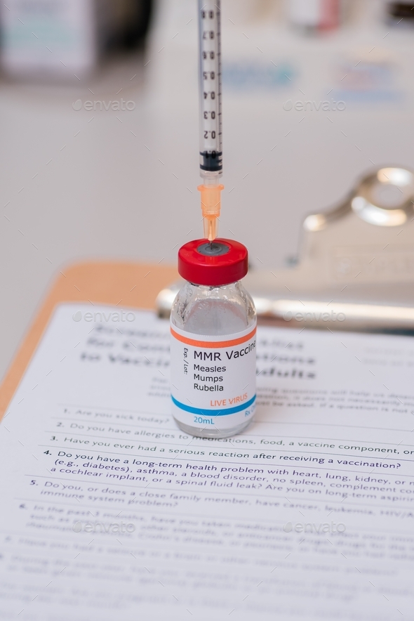 measles mumps and rubella vaccination (MMR) concept, syringe in vaccine ...
