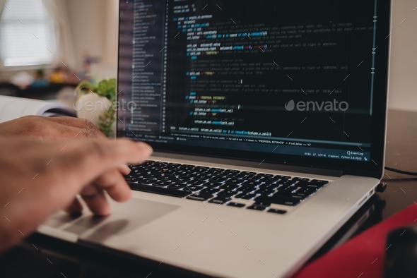 African American man sitting in front of computer coding, programming, web developer Stock Photo ...