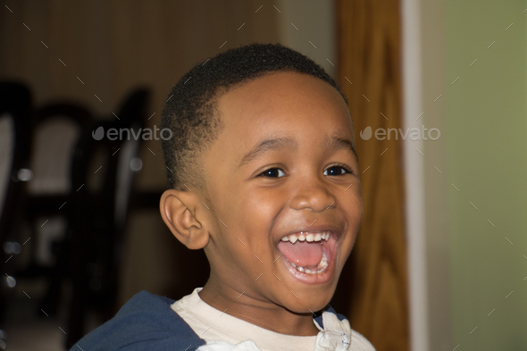 Happy African American boy at home laughing, Black and beautiful ...