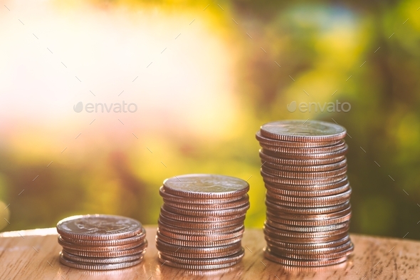 Savings concept, three stacks of American quarters pile like bar graph ...