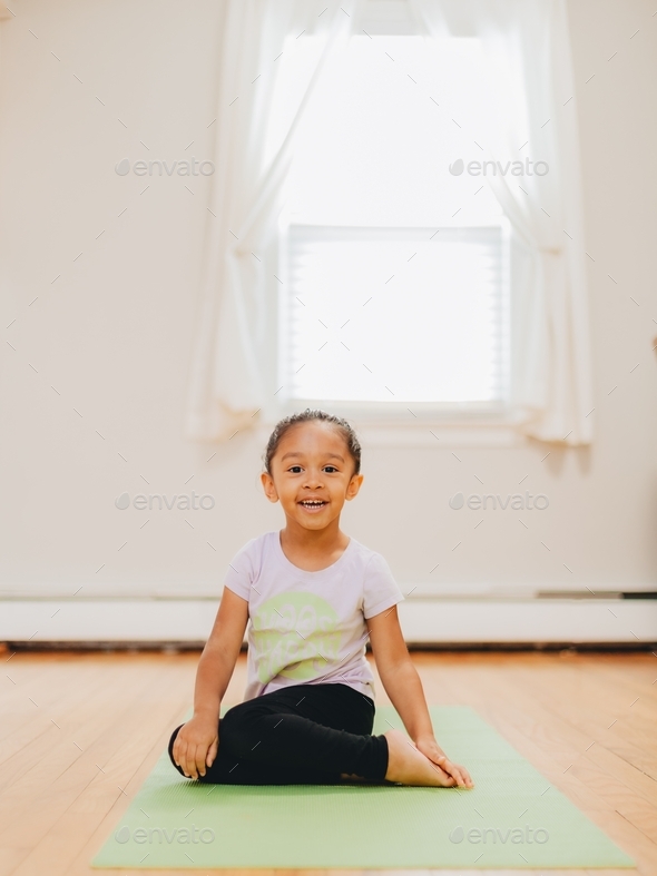 Kids staying active concept, diverse preschooler girl working out at ...