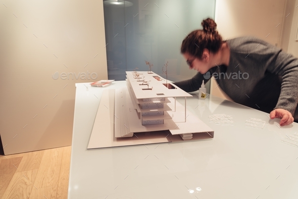 Architect making an architectural model Stock Photo by JJFarquitectos