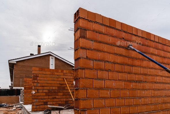Works of construction of thermal clay block walls Stock Photo by ...