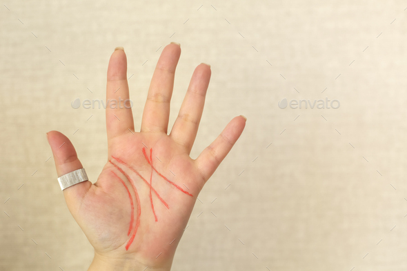 Palmistry. Female palm with life lines drawn with felt-tip pen isolated ...