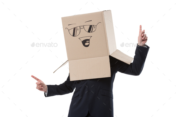 successful businessman with box with smile sign on head pointing up ...
