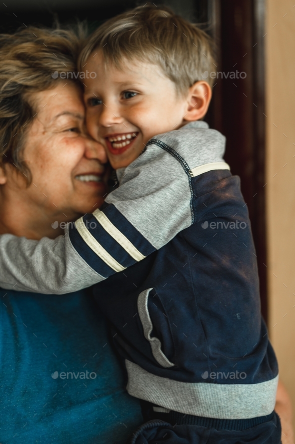 Grandma hugs her grandson tightly Stock Photo by nastuffa | PhotoDune