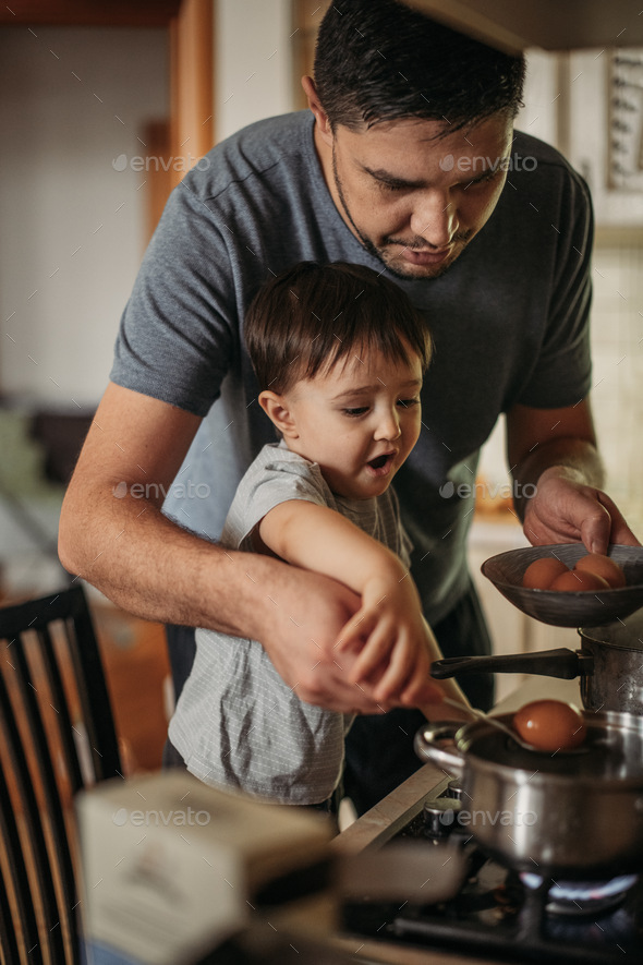 dad and son are cooking in the kitchen Stock Photo by nastuffa | PhotoDune