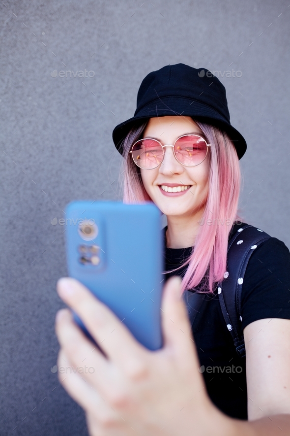 Taking selfie self portrait photos on smartphone Stock Photo by ...