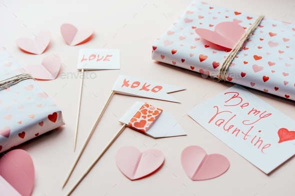 Decorations and gifts for valentine's day on a pink surface. Props and ...