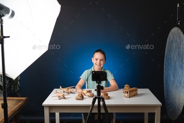 Young guy streaming for his fans. Boy explaining in front of camera ...
